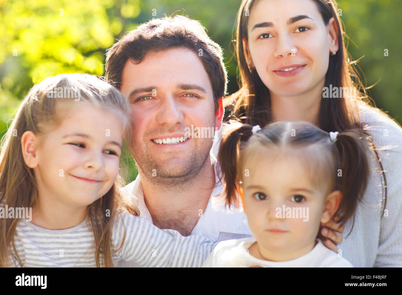 Happy family with two children outdoors Stock Photo - Alamy