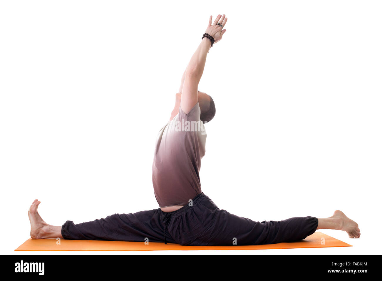 Side view of yoga trainer posing on split Stock Photo - Alamy