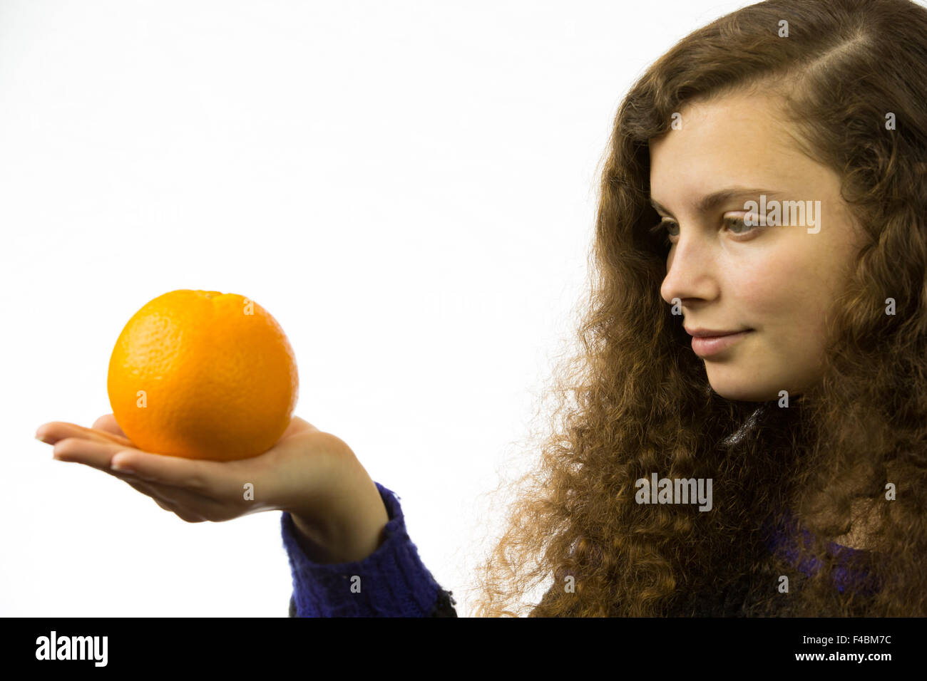 Girl with orange 6 Stock Photo - Alamy