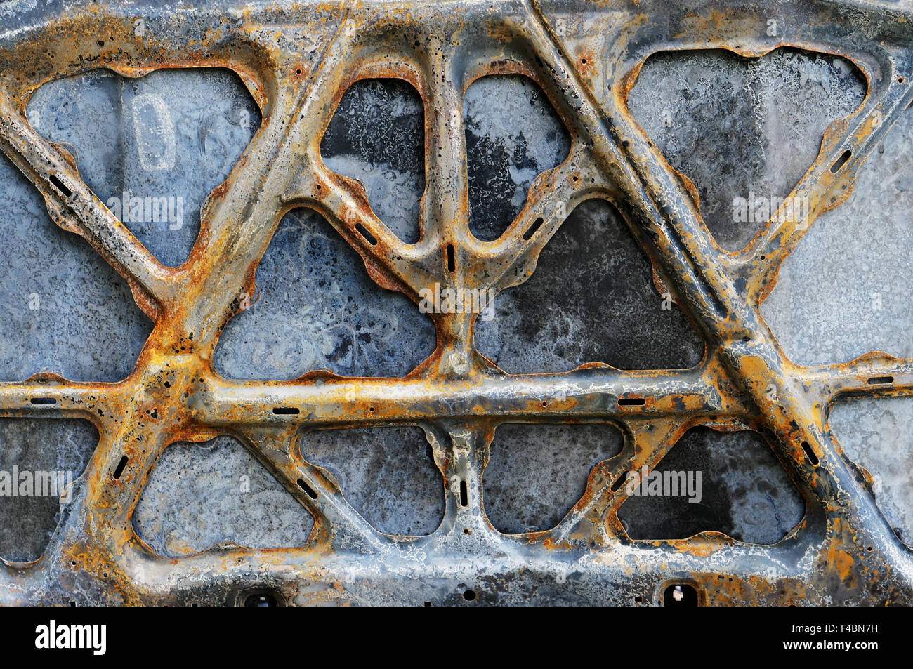 Internal surface of a cowl of the burned-down rusty car background ...