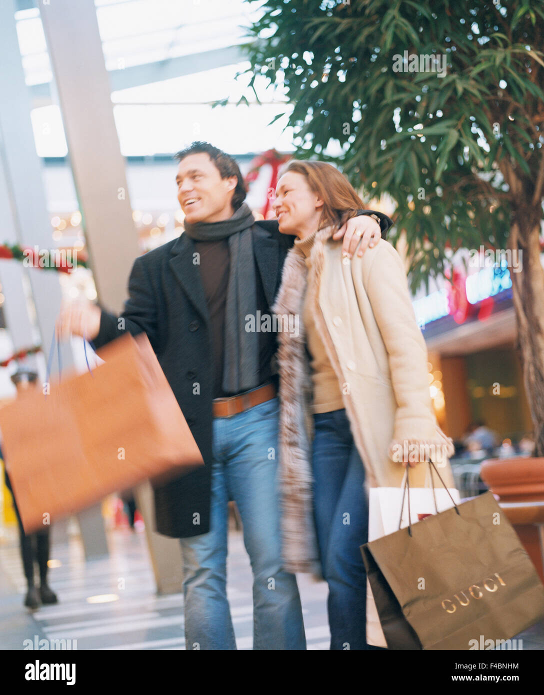 Man and woman shopping in the mall Stock Photo - Alamy