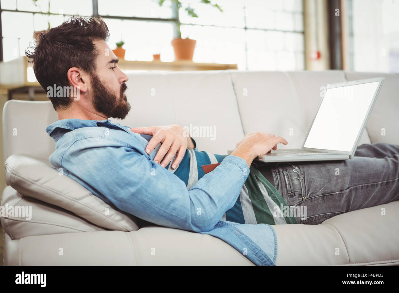 Man using laptop at home Stock Photo - Alamy