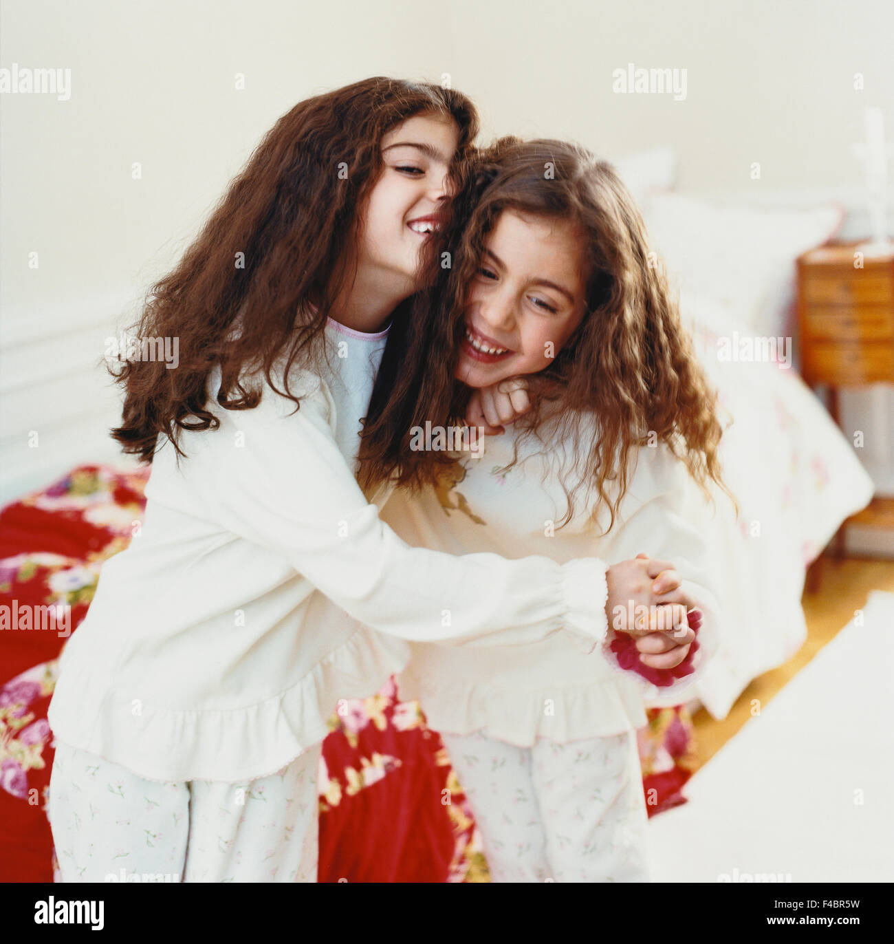 Girls laughing, hugging and dancing together Stock Photo - Alamy