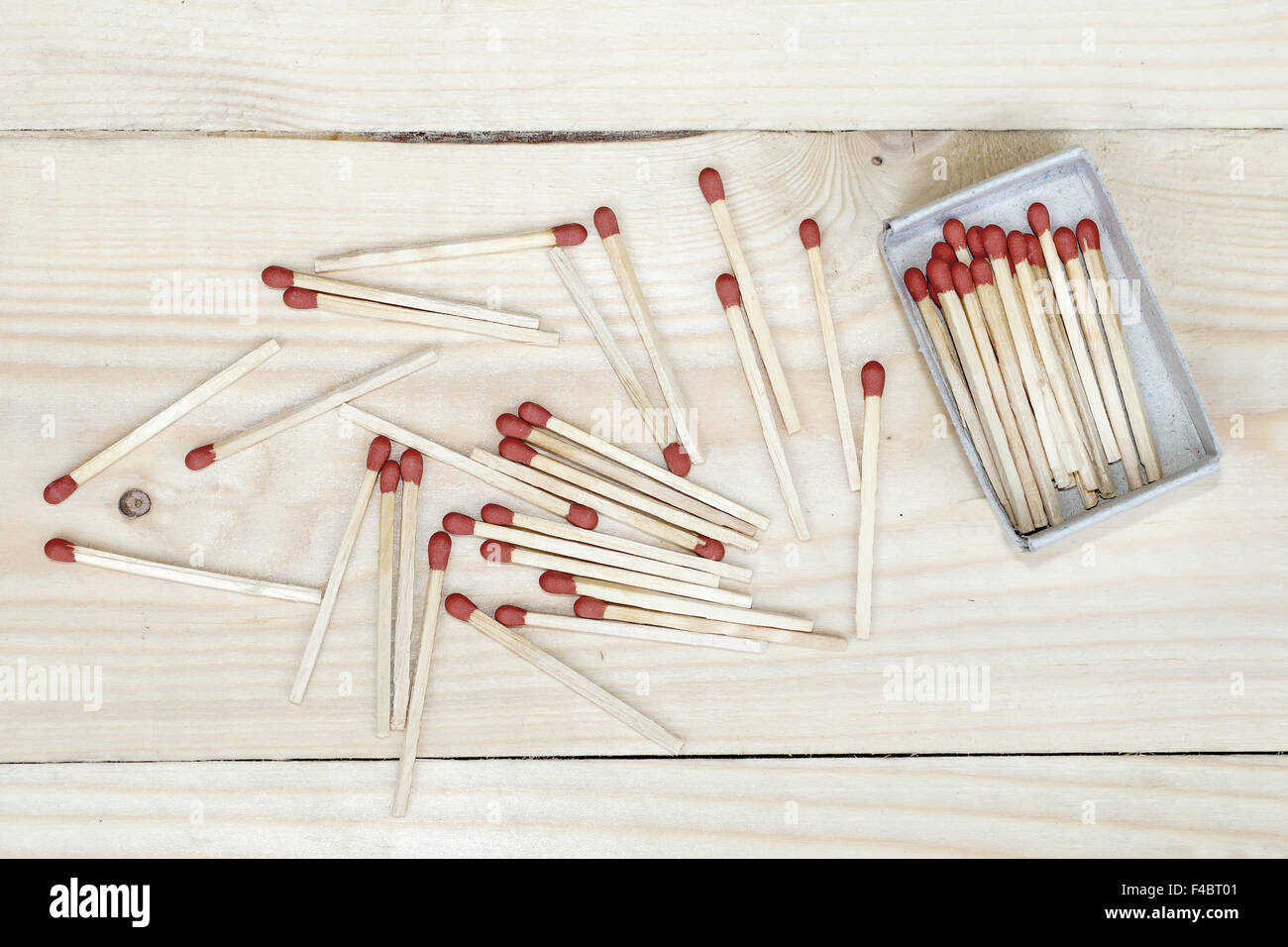 pile of matchstick and matchbox on wooden background Stock Photo - Alamy