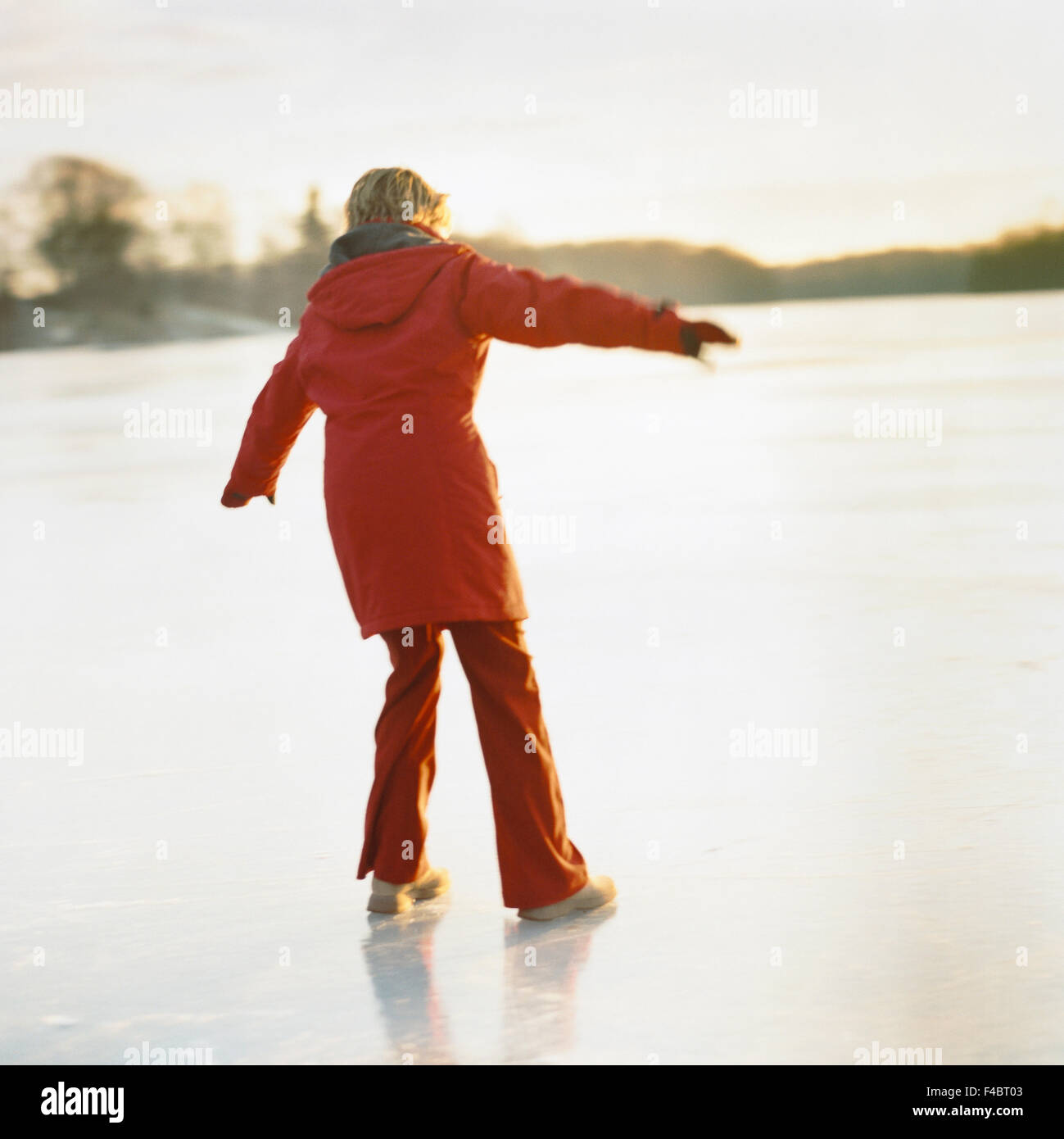 Girl standing on ice Stock Photo - Alamy