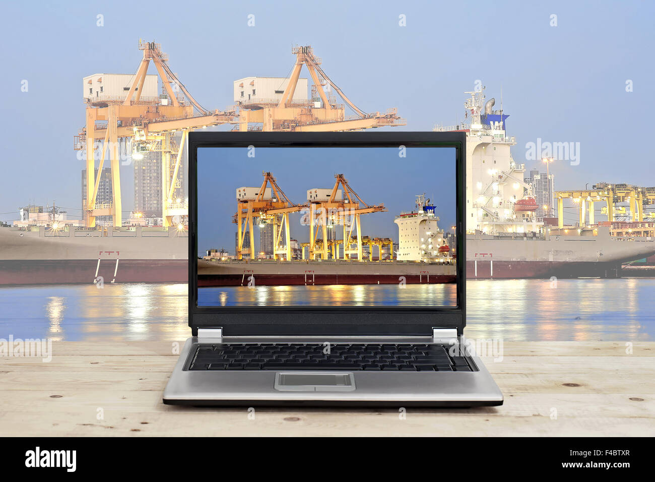 logistic business concept idea, laptop on wooden table with port ...