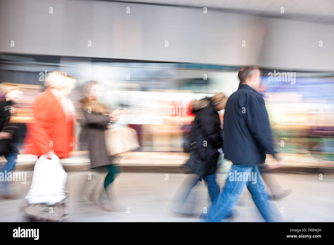 A shopper walking past a store window Stock Photo - Alamy