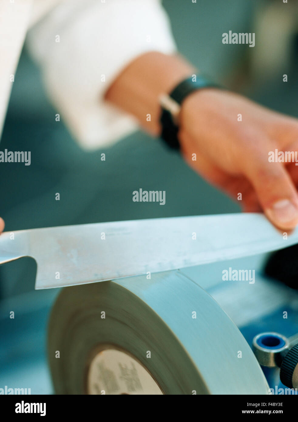 body part part of color image grindstone handicraft human hand knife ...