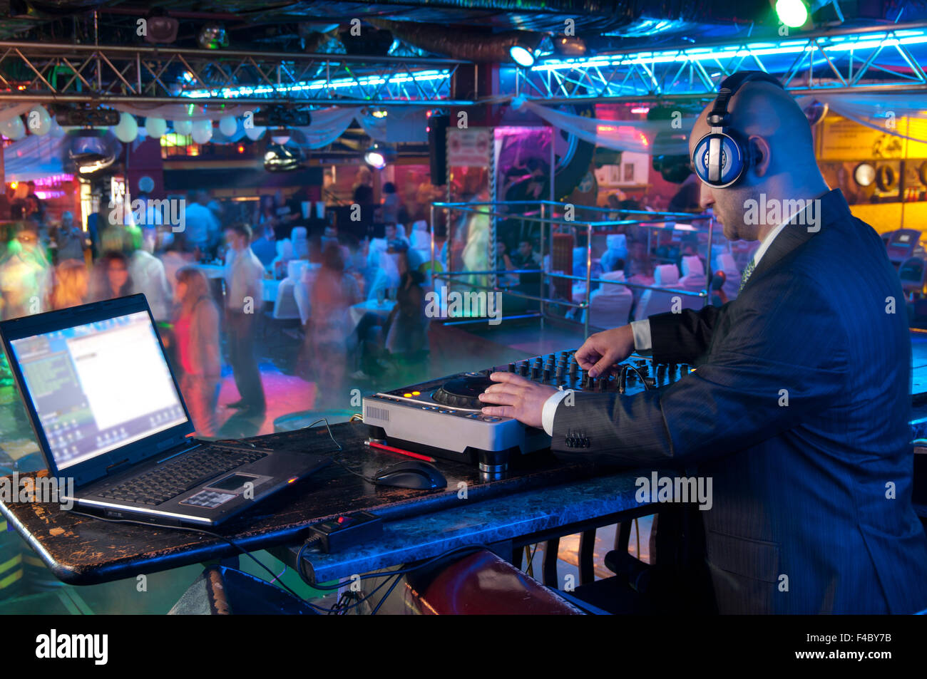 DJ behind the control panel Stock Photo - Alamy