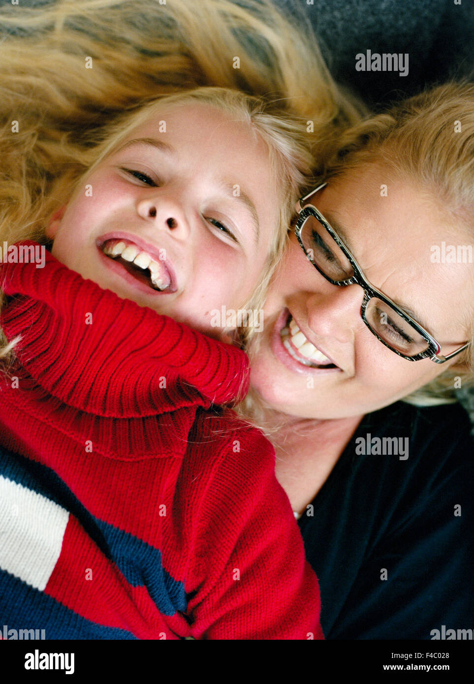 Laughing mother and daughter together Stock Photo - Alamy