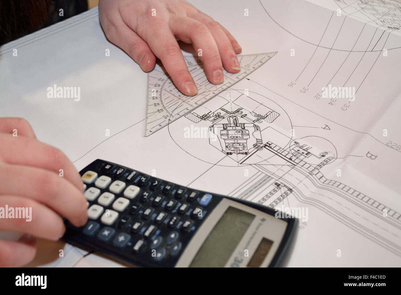 Person with technical drawing Stock Photo - Alamy