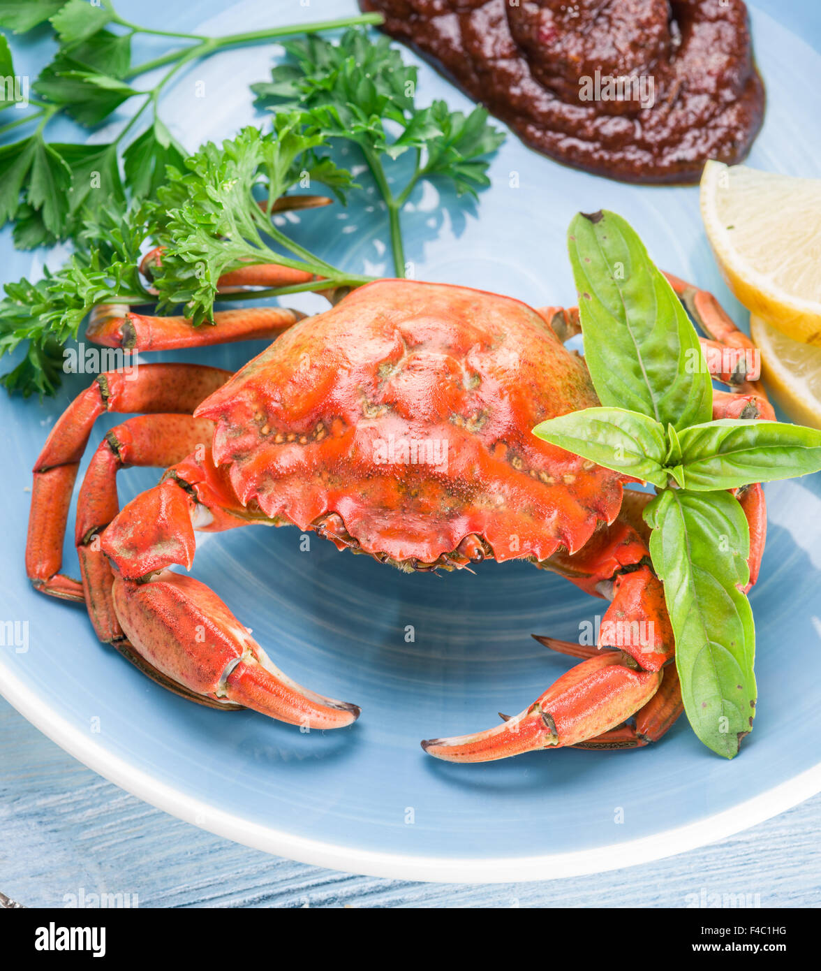 Seafood dish - cooked crab with lemon and herbs Stock Photo - Alamy