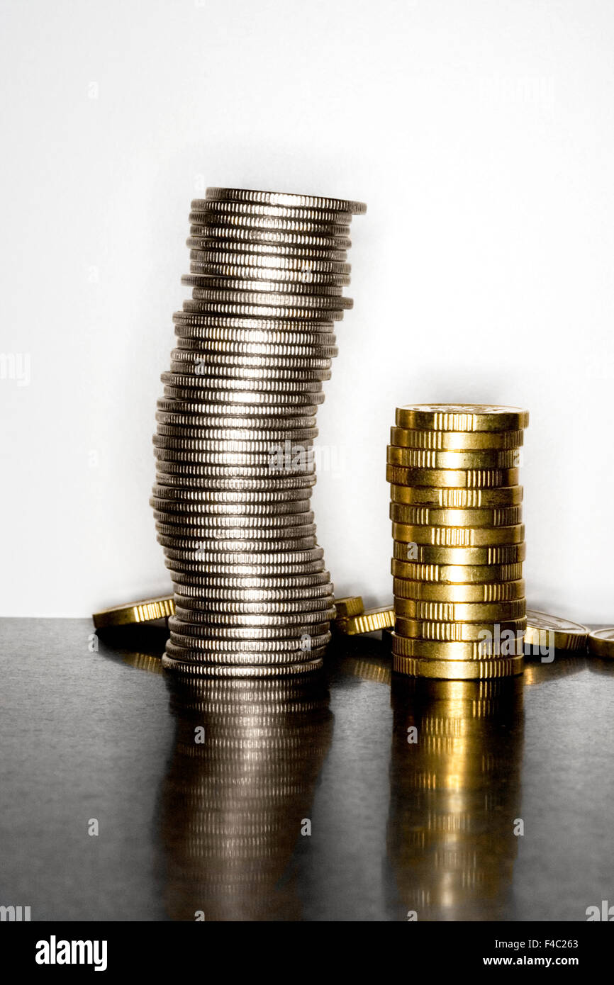 Two piles of coins, close-up Stock Photo - Alamy