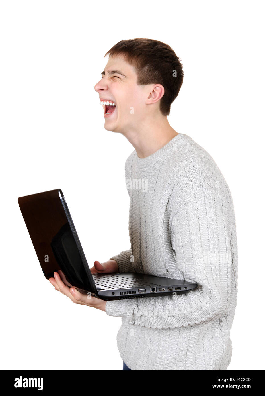 Teenager laughing with Laptop Stock Photo - Alamy