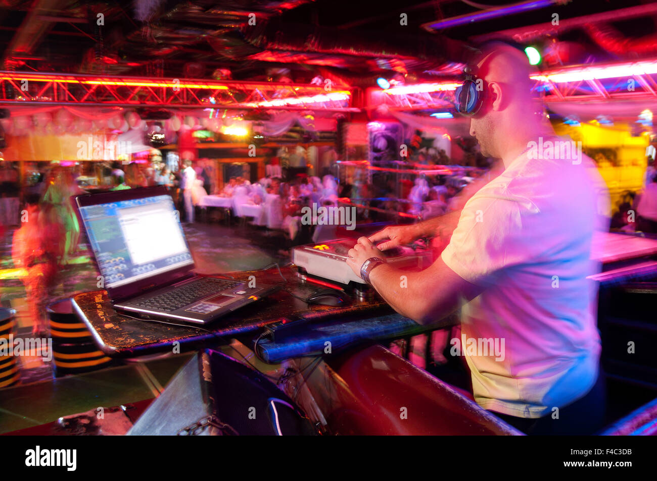 DJ behind the control panel Stock Photo - Alamy