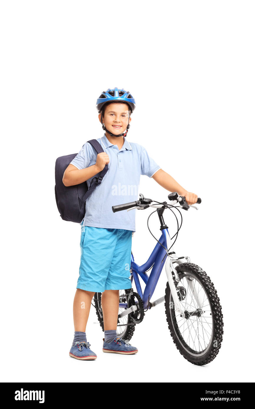 Full length portrait of a cute little schoolboy carrying a backpack and ...