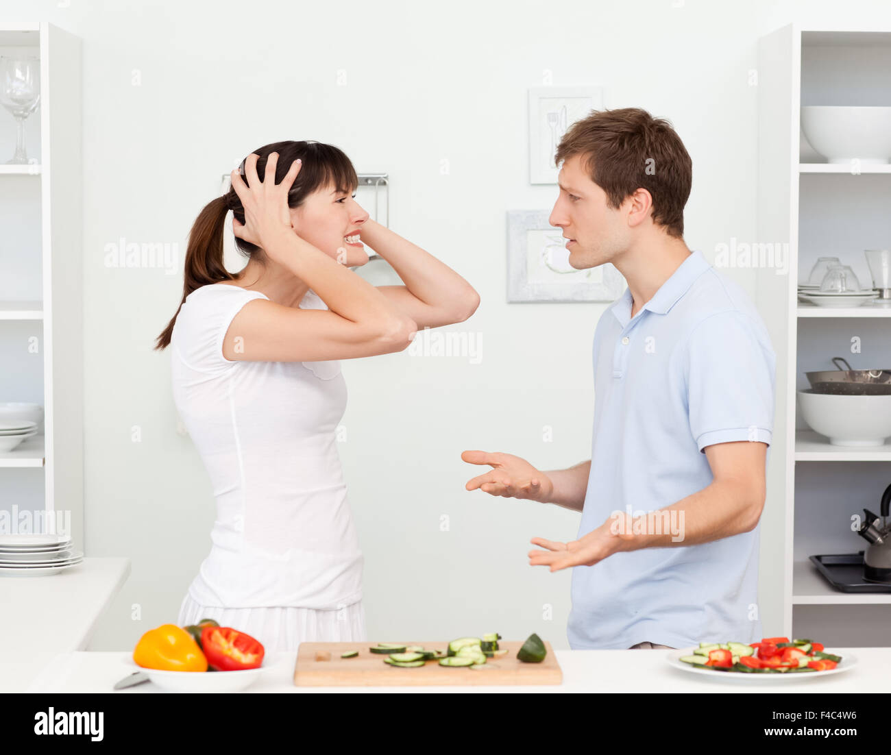 Young lovers having dispute in the kitchen Stock Photo - Alamy