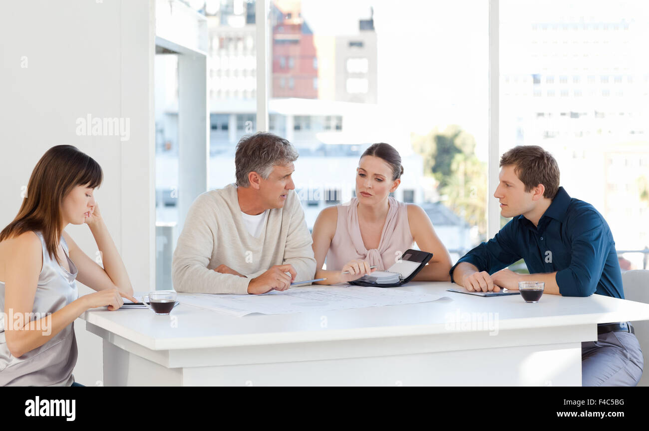 Coworkers working in their office Stock Photo - Alamy