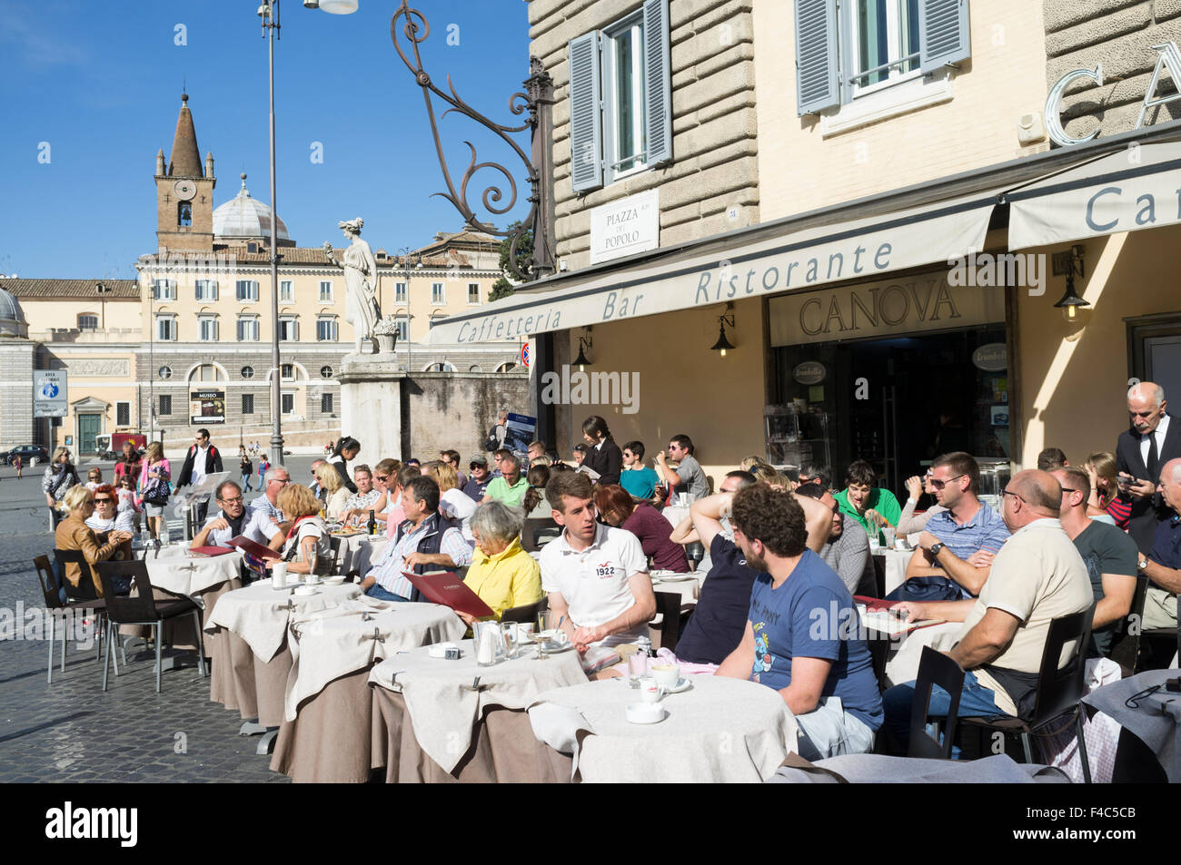 People at an alfresco bar in Piazza del Popolo square, Rome, Italy ...