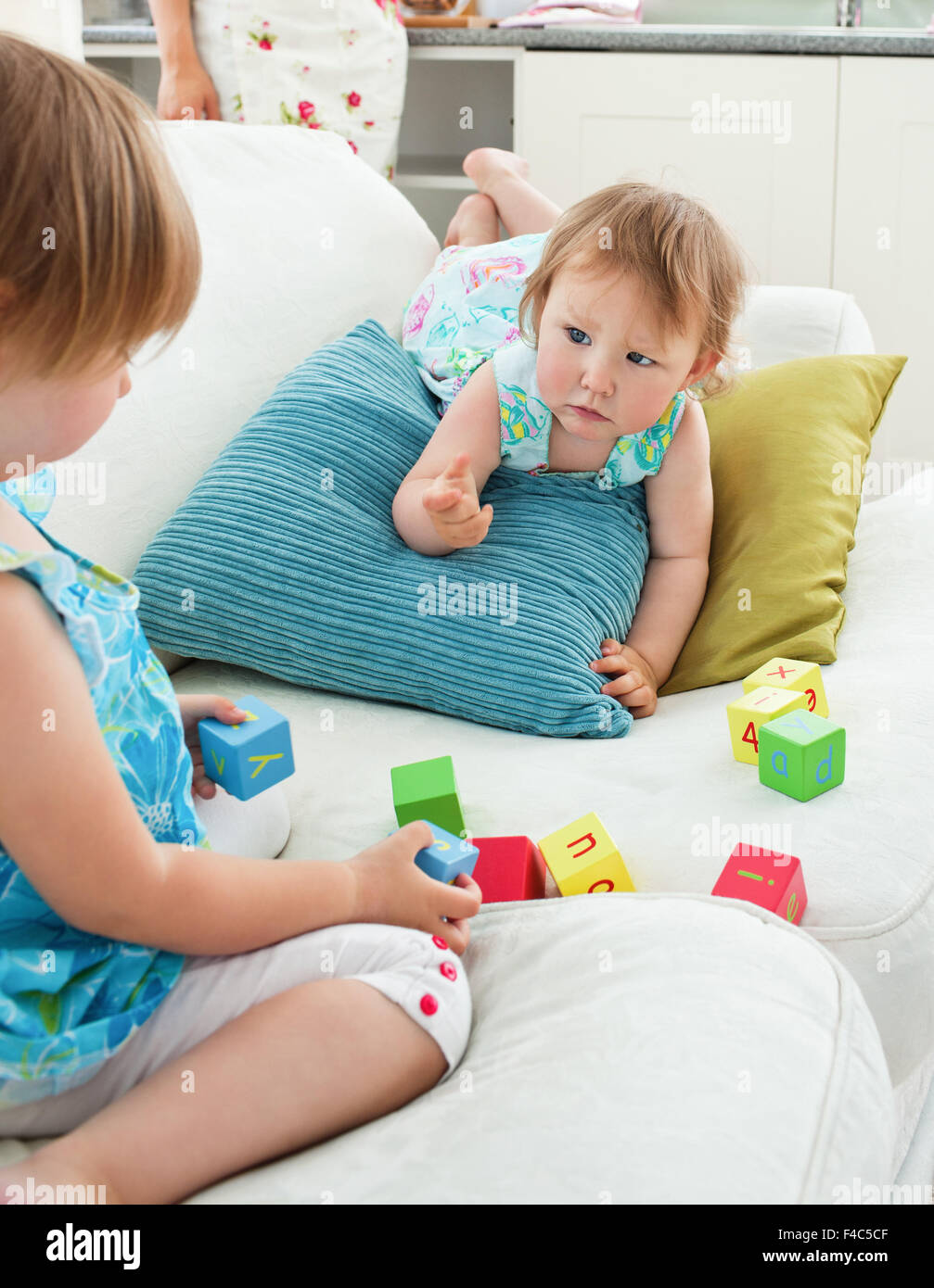 Adorable sweet siblings playing together Stock Photo - Alamy