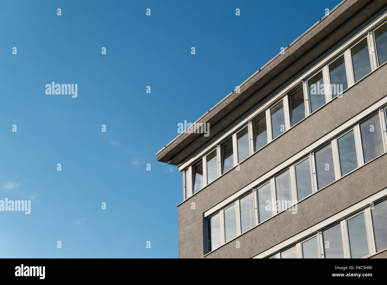 Office building with windows and blue sky Stock Photo - Alamy
