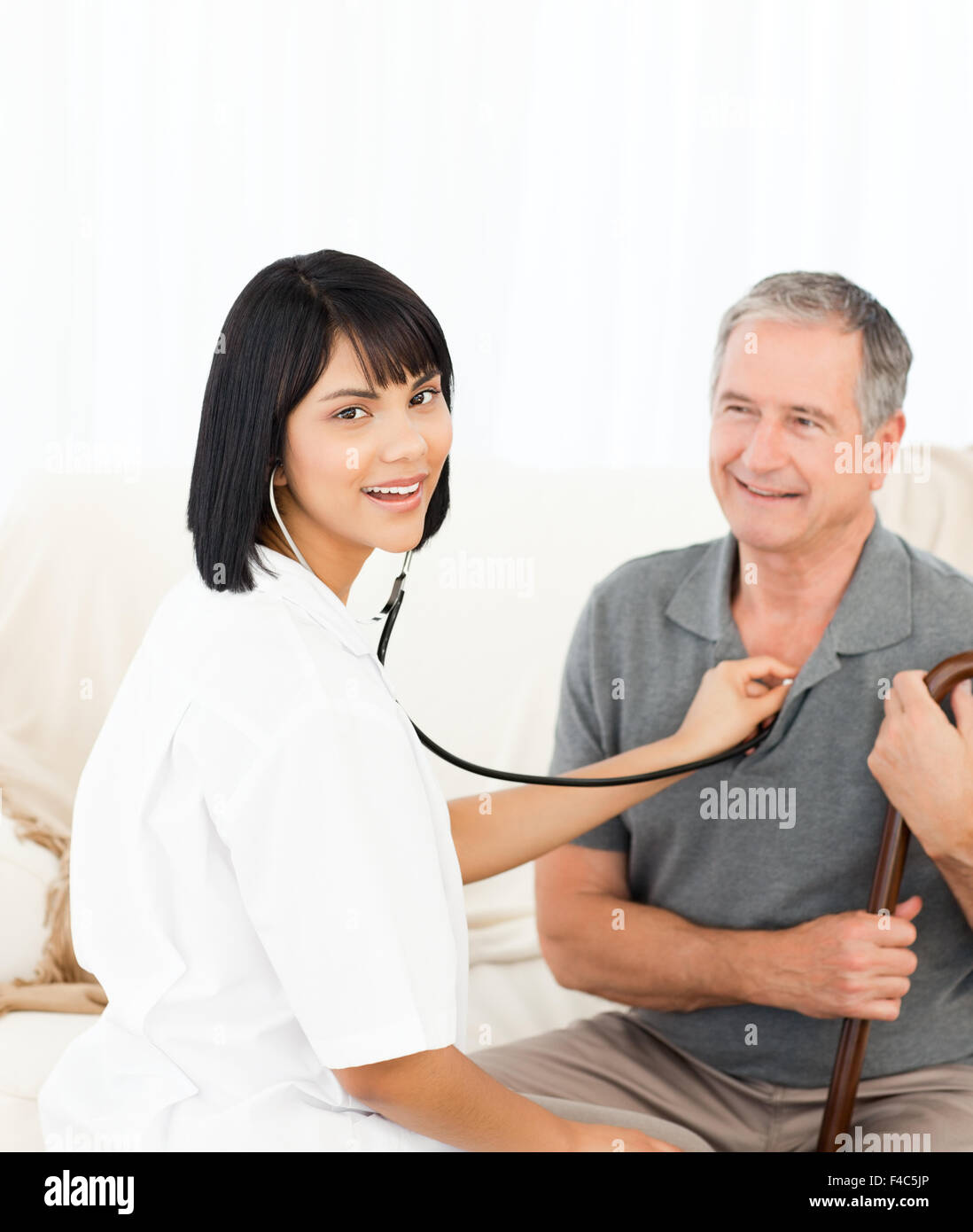 Nurse with her patient looking at the camera Stock Photo - Alamy