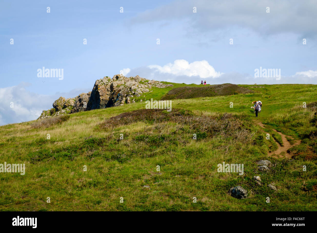 Walkers on the South West Coast path on the Lizard Peninsula, Cornwall ...