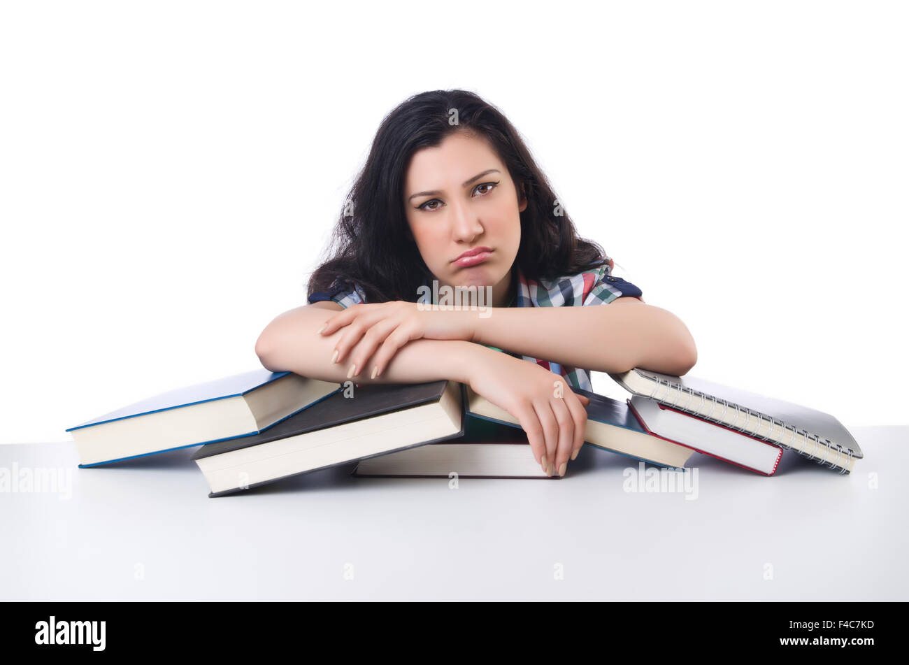 Tired student with textbooks on white Stock Photo - Alamy