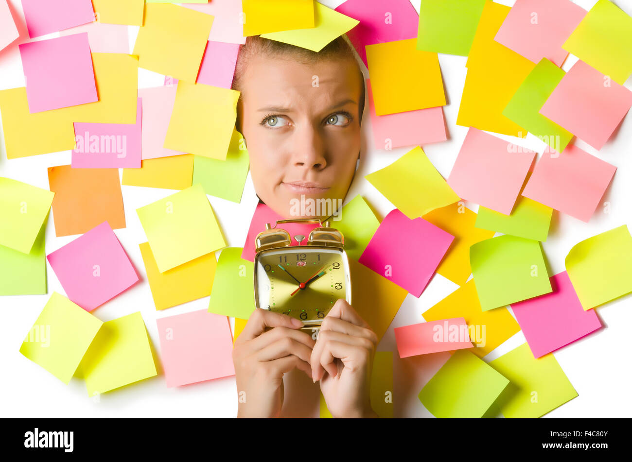 Woman with clock and lots of reminders Stock Photo - Alamy