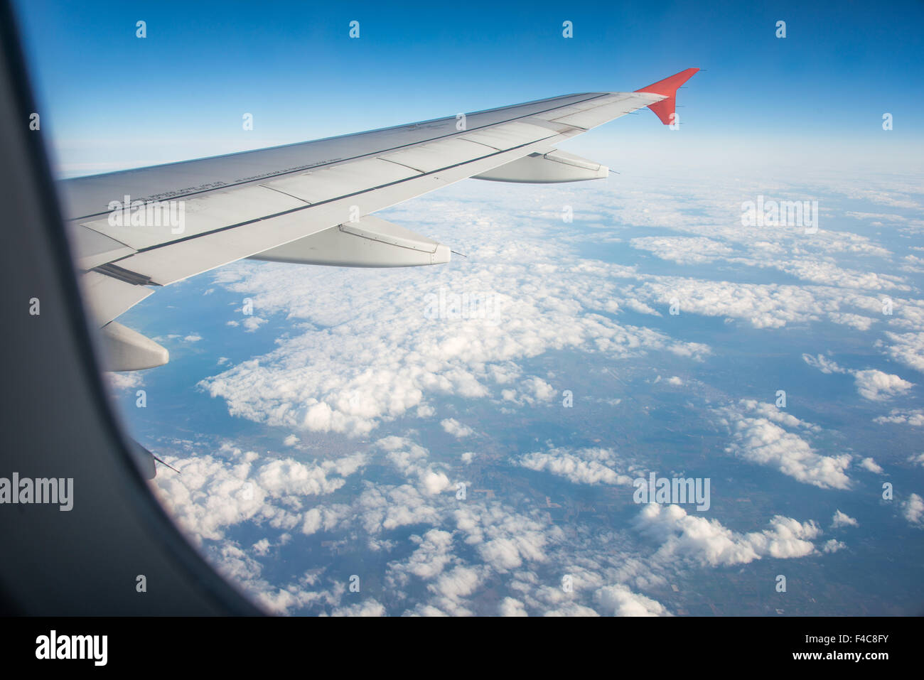 Airplane wing out of window Stock Photo - Alamy