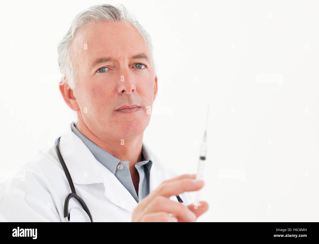 Senior doctor with syringes Stock Photo - Alamy