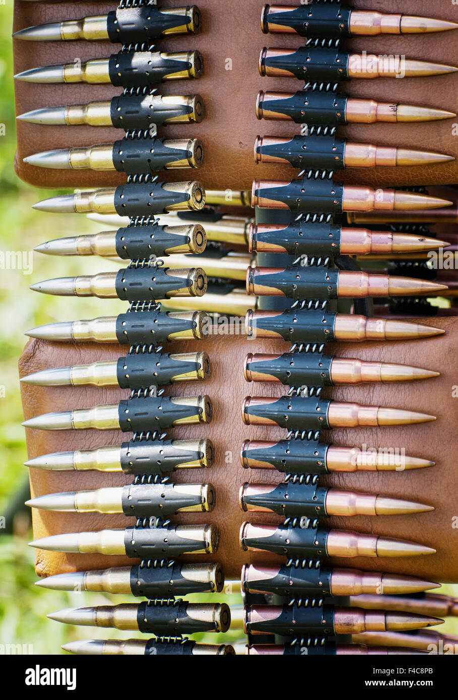 Bullets in ammunition belt for machine gun. Vertical composition Stock ...