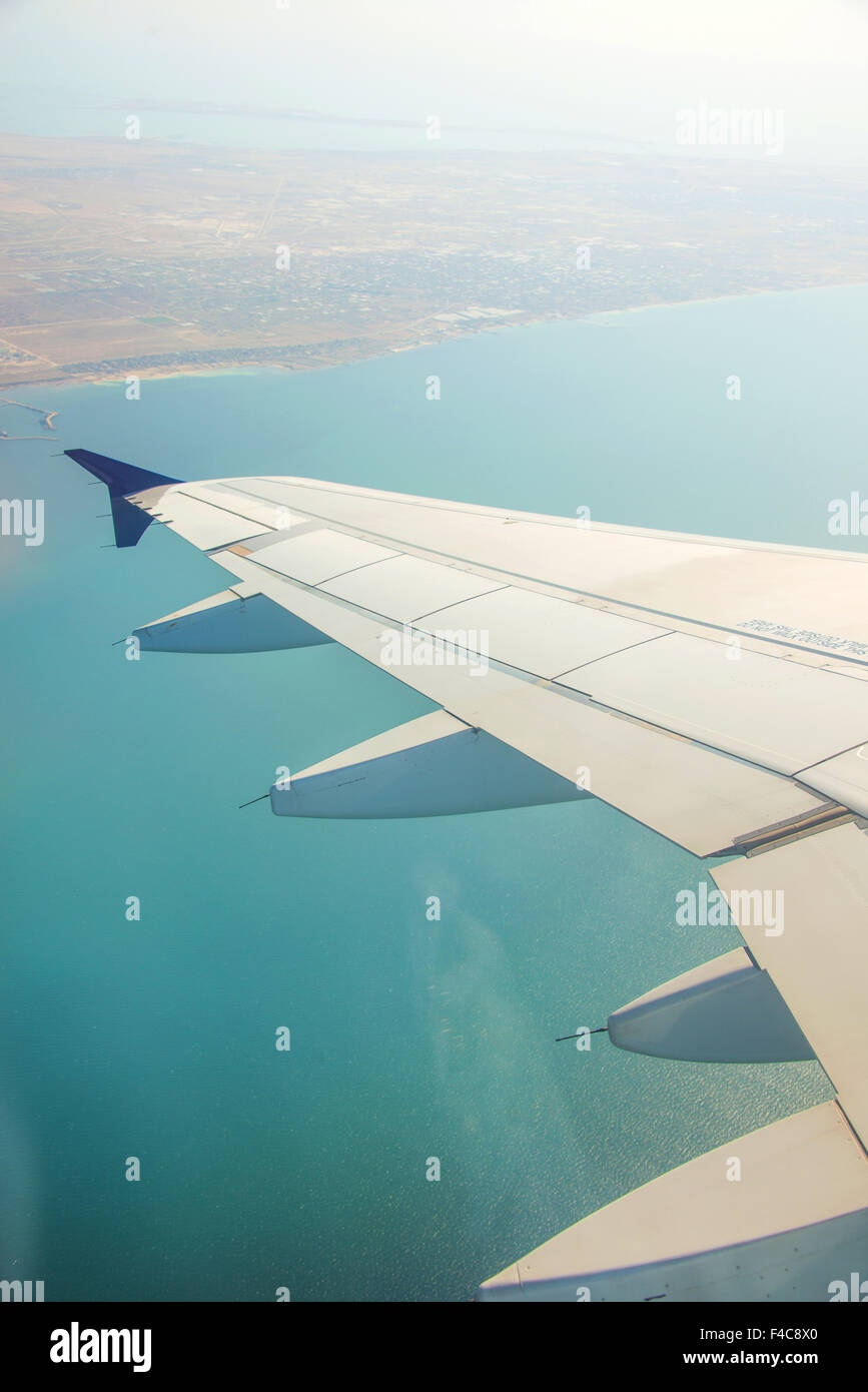 Airplane wing out of window Stock Photo - Alamy