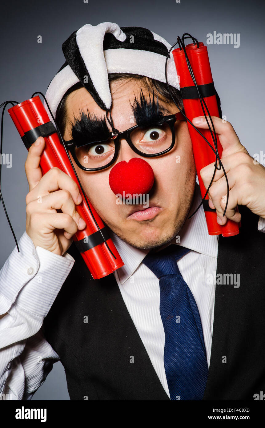 Funny clown with sticks of dynamite Stock Photo - Alamy