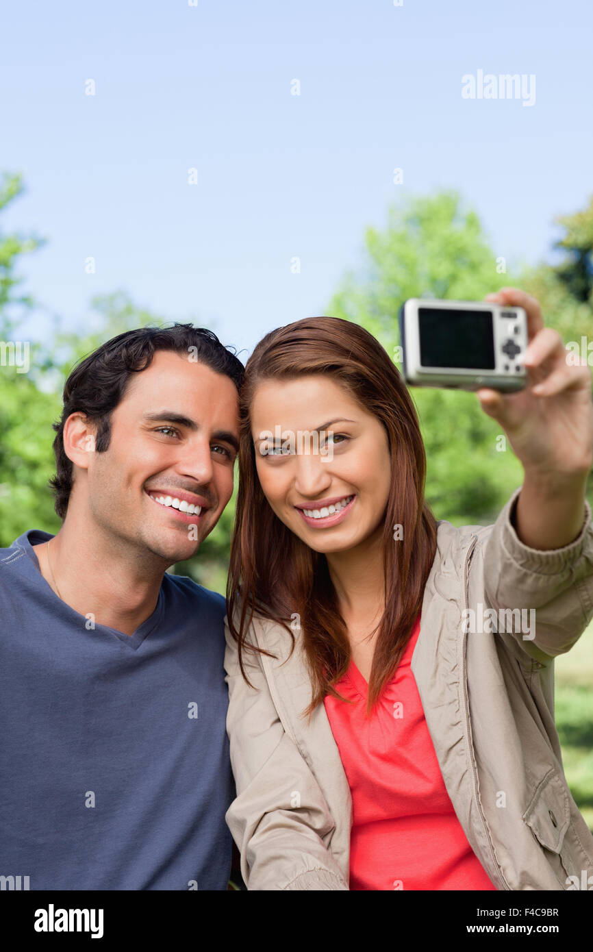 Woman and her friend looking towards her camera for a picture of them ...