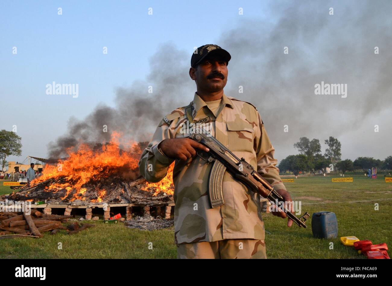 Lahore. 15th Oct, 2015. A Pakistani anti-narcotics official stands ...
