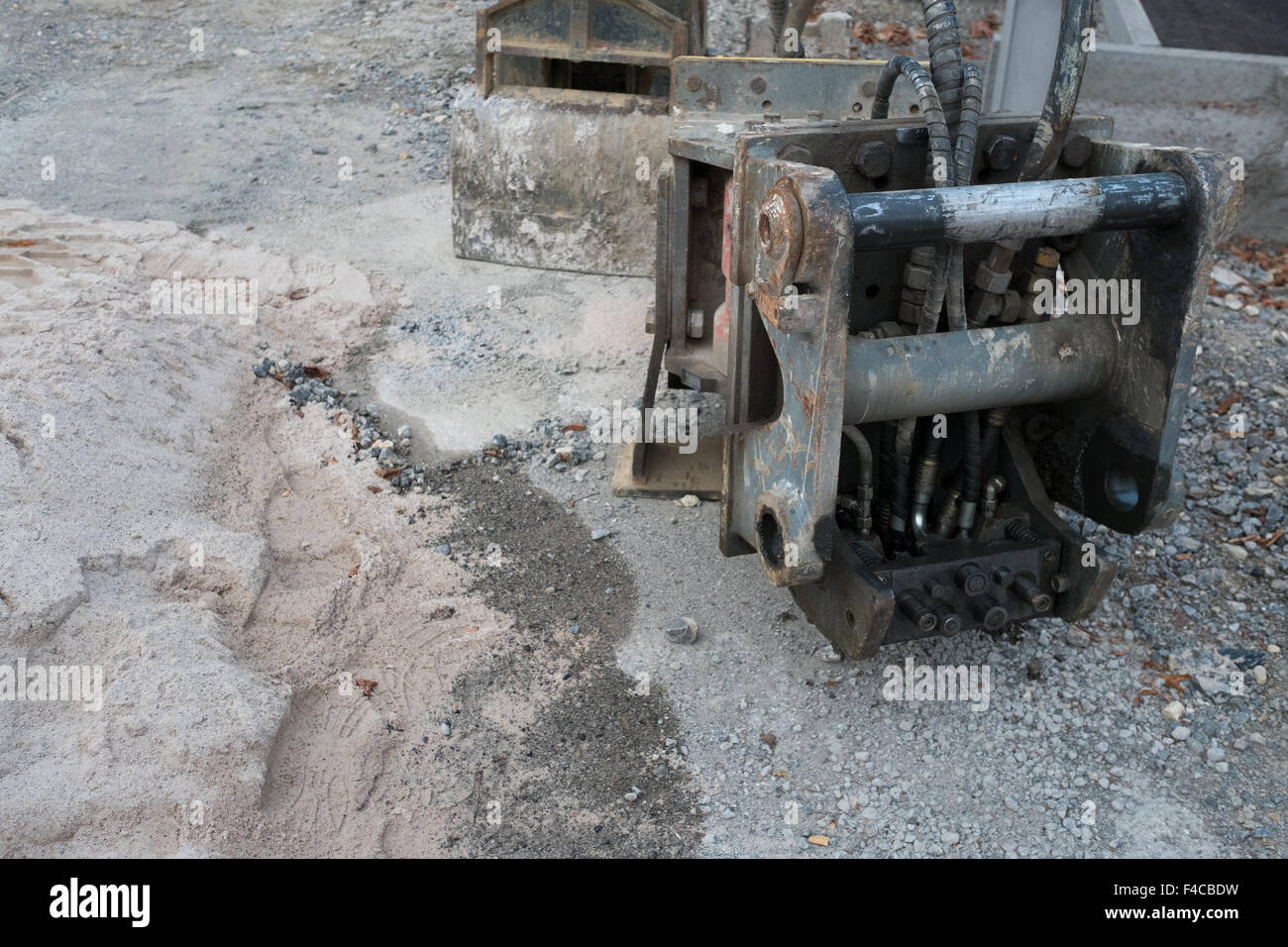 Construction equipment on a road works with sand and pebbles Stock ...