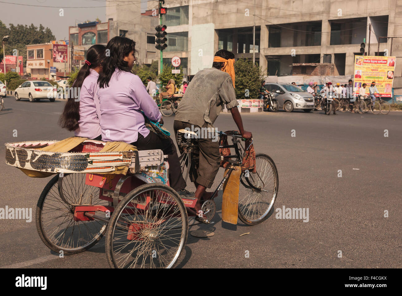 India, Punjab, Amritsar. Man driving women on cycle rickshaw Stock ...