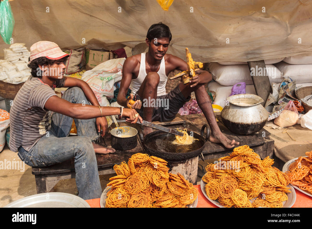 India, Odisha, Subarnapur District, Sonepur, Men preparing street food ...