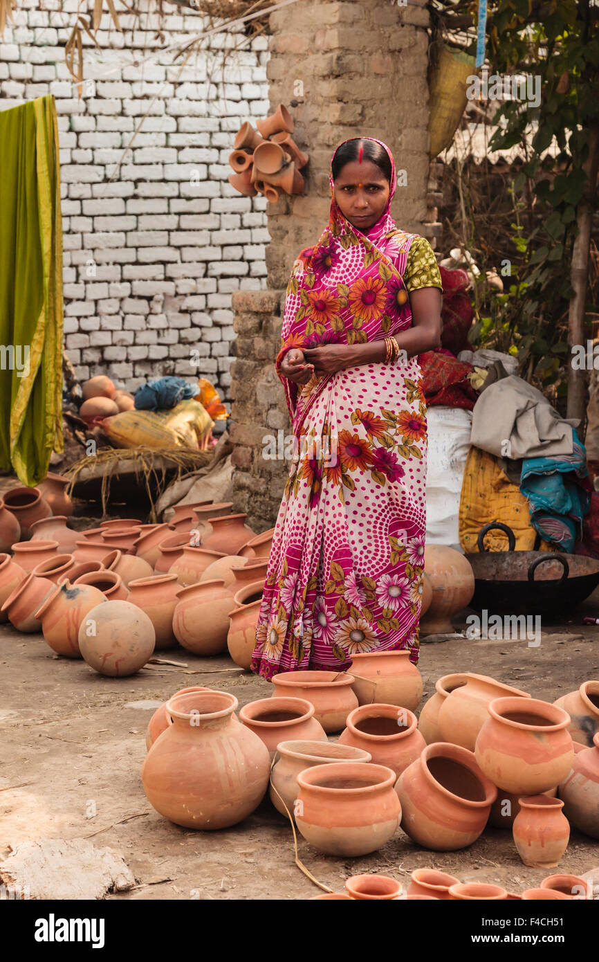 India, Odisha, Subarnapur District, Sonepur, Woman with pottery at ...