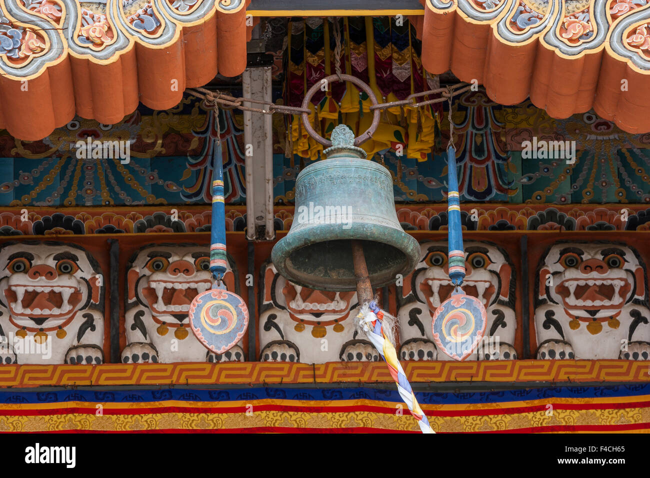Bronze bell hanging outside a Buddhist monastery, Bhutan Stock Photo ...