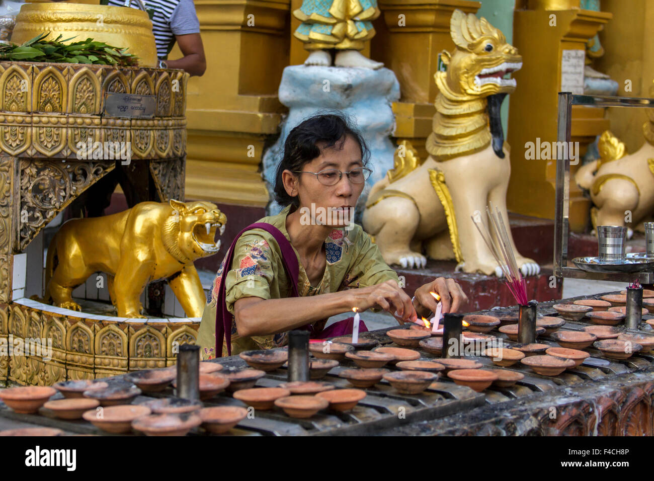 Preparing the candle lights. Shwedagon Pagoda. Yangon. Myanmar Stock ...