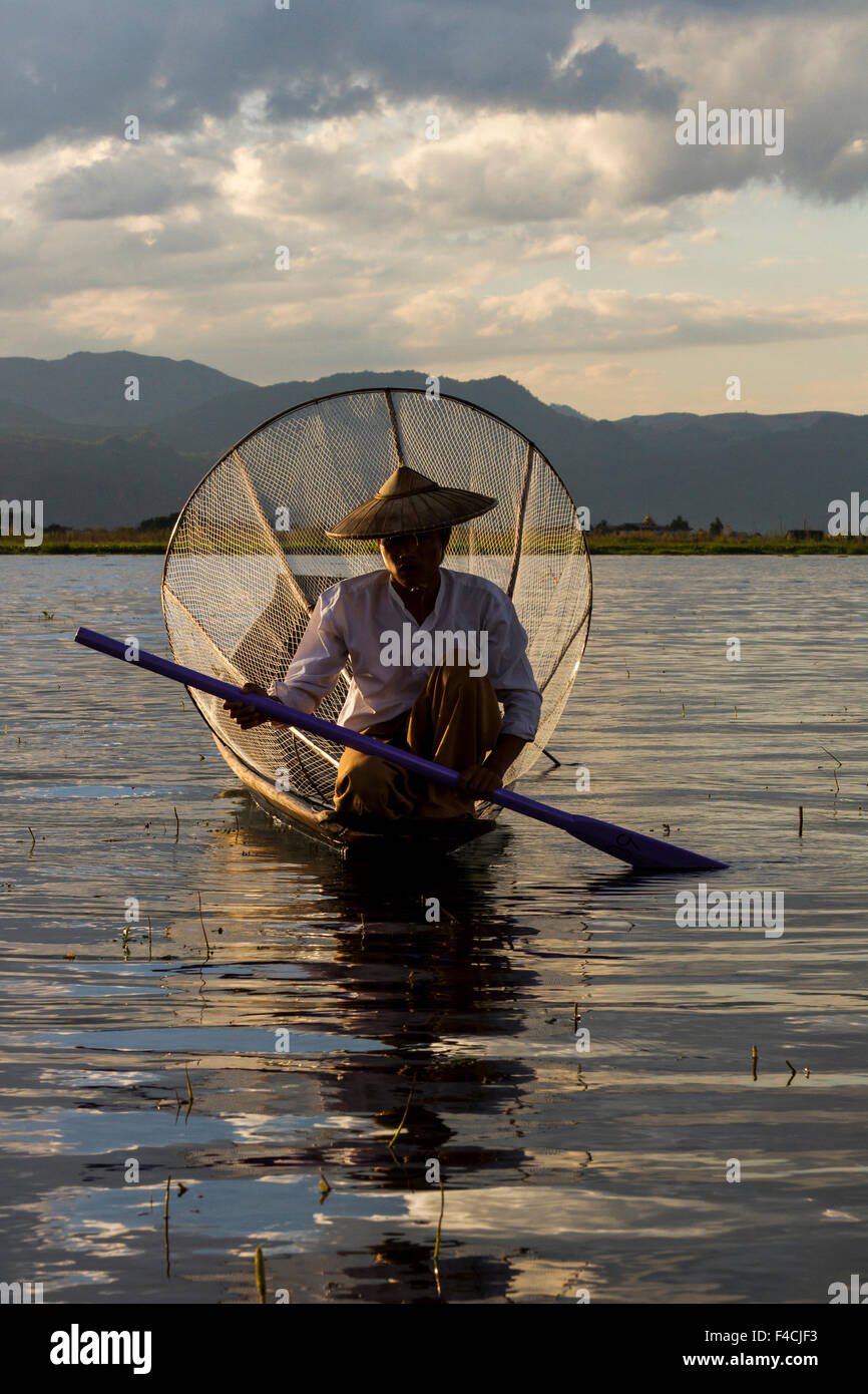 Intha fisherman at work. Using the legs for rowing. Inle Lake. Myanmar ...