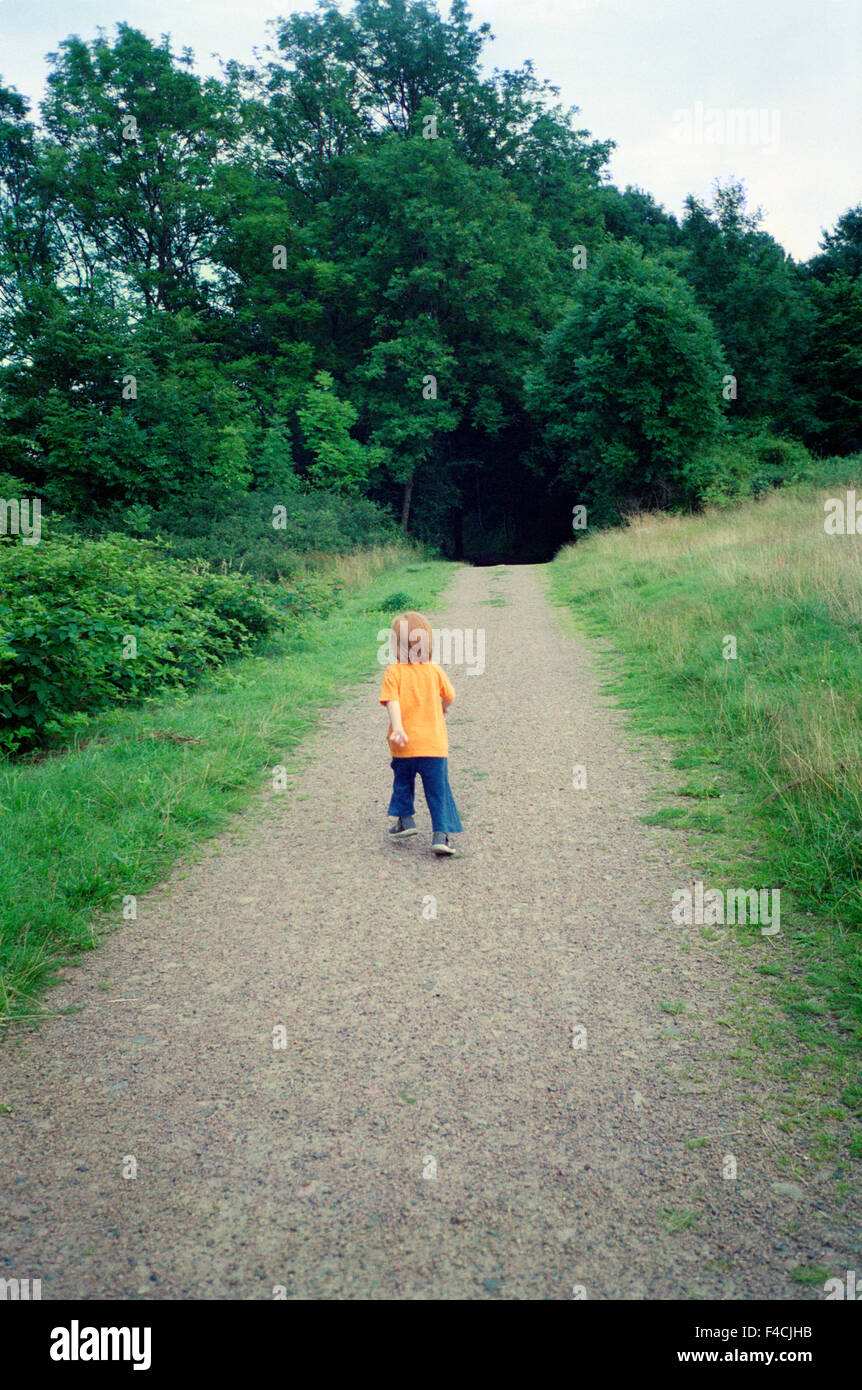 Boy on a Road Stock Photo - Alamy