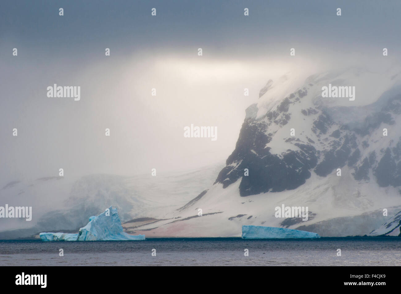 Antarctica. Bransfield Strait. Iceberg under stormy skies Stock Photo ...