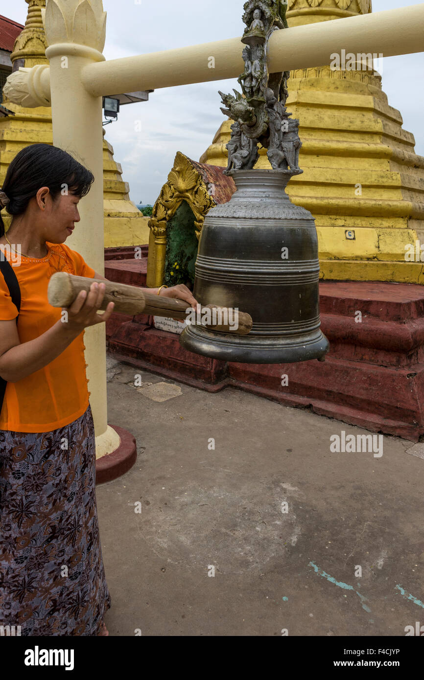 Woman ringing temple bell hi-res stock photography and images - Alamy