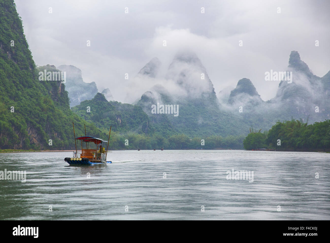 China, Yangshuo Province, Guilin. Bamboo raft on the Li River. Credit ...