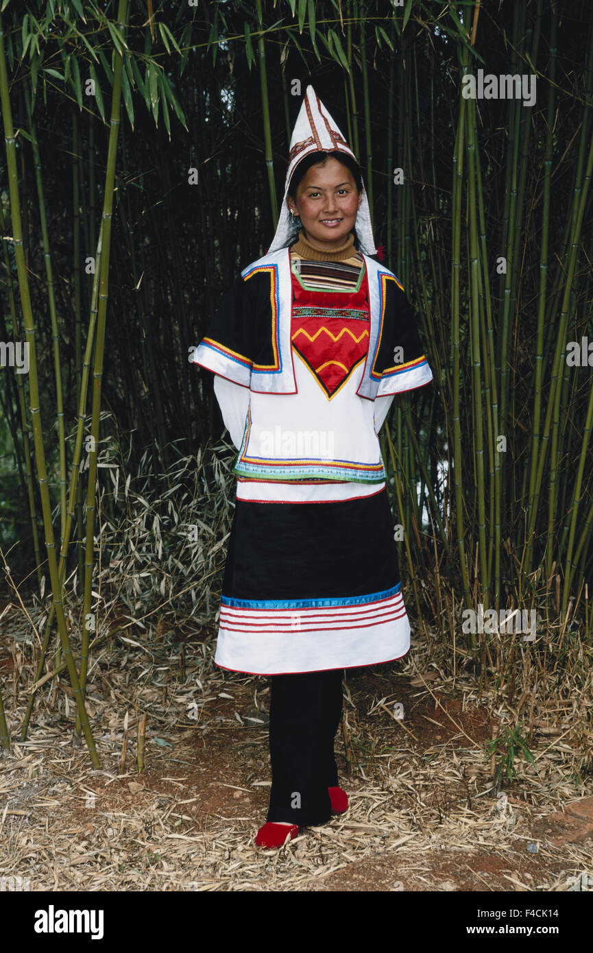 China, Yunnan Province, Kunming, Young Jinuo woman in traditional ...