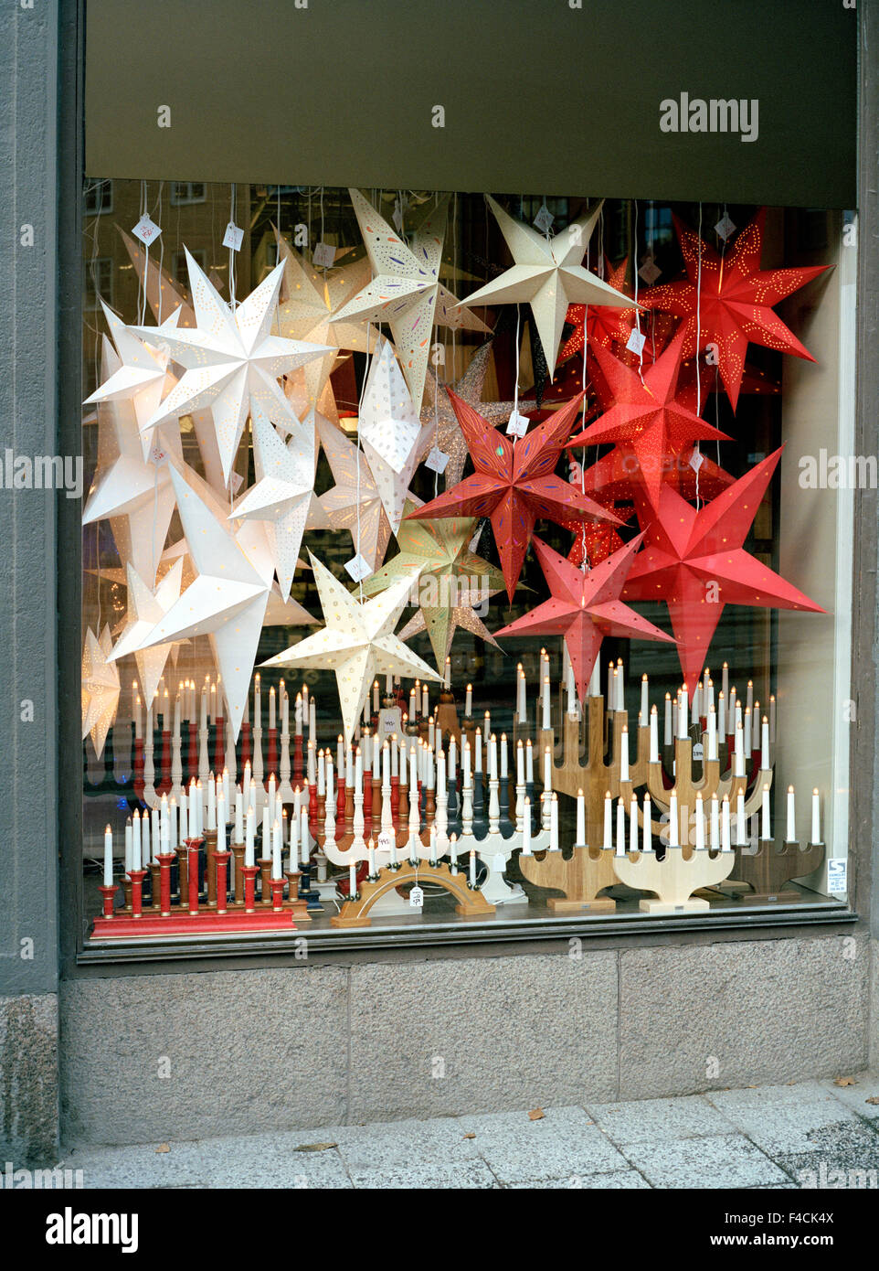A sign window full of Christmas stars and Advent lights Stock Photo - Alamy