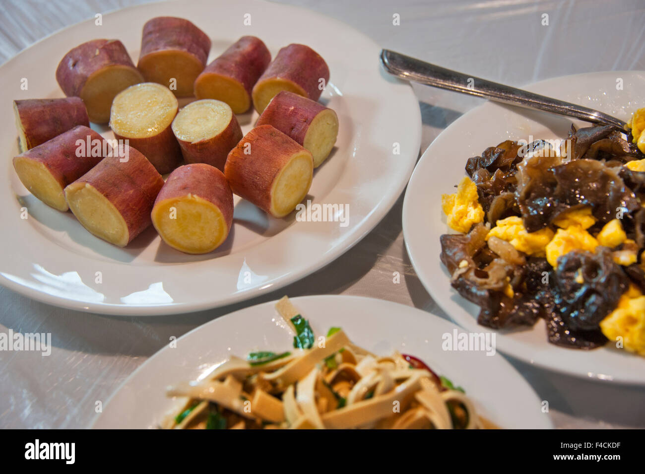 China, Shaanxi. Dishes of boiled red potatoes, scrambled eggs and ...